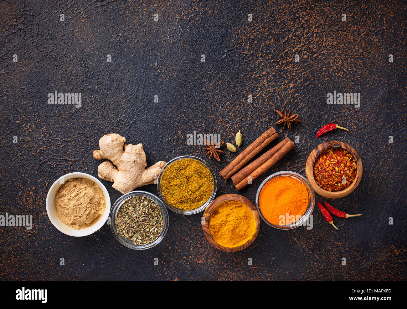Traditional Indian spices. Turmeric, chili pepper, curry ginger and ...