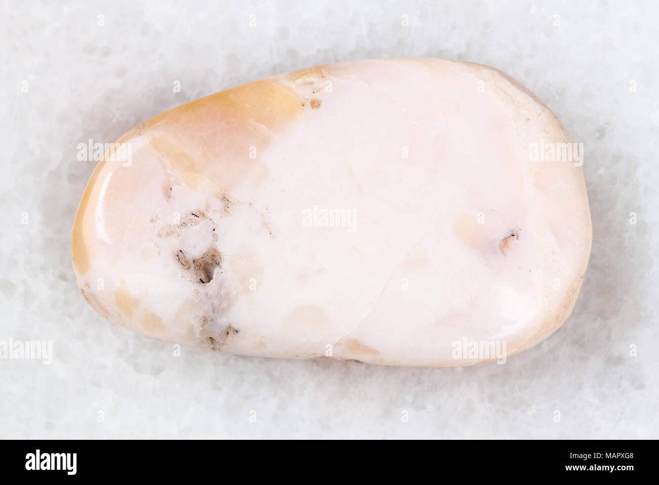 macro shooting of natural mineral rock specimen - polished pink opal ...