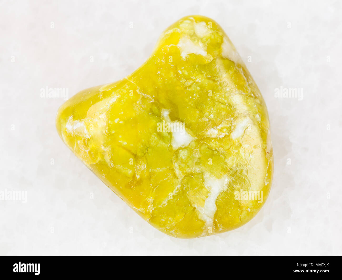 macro shooting of natural mineral rock specimen - polished yellow ...