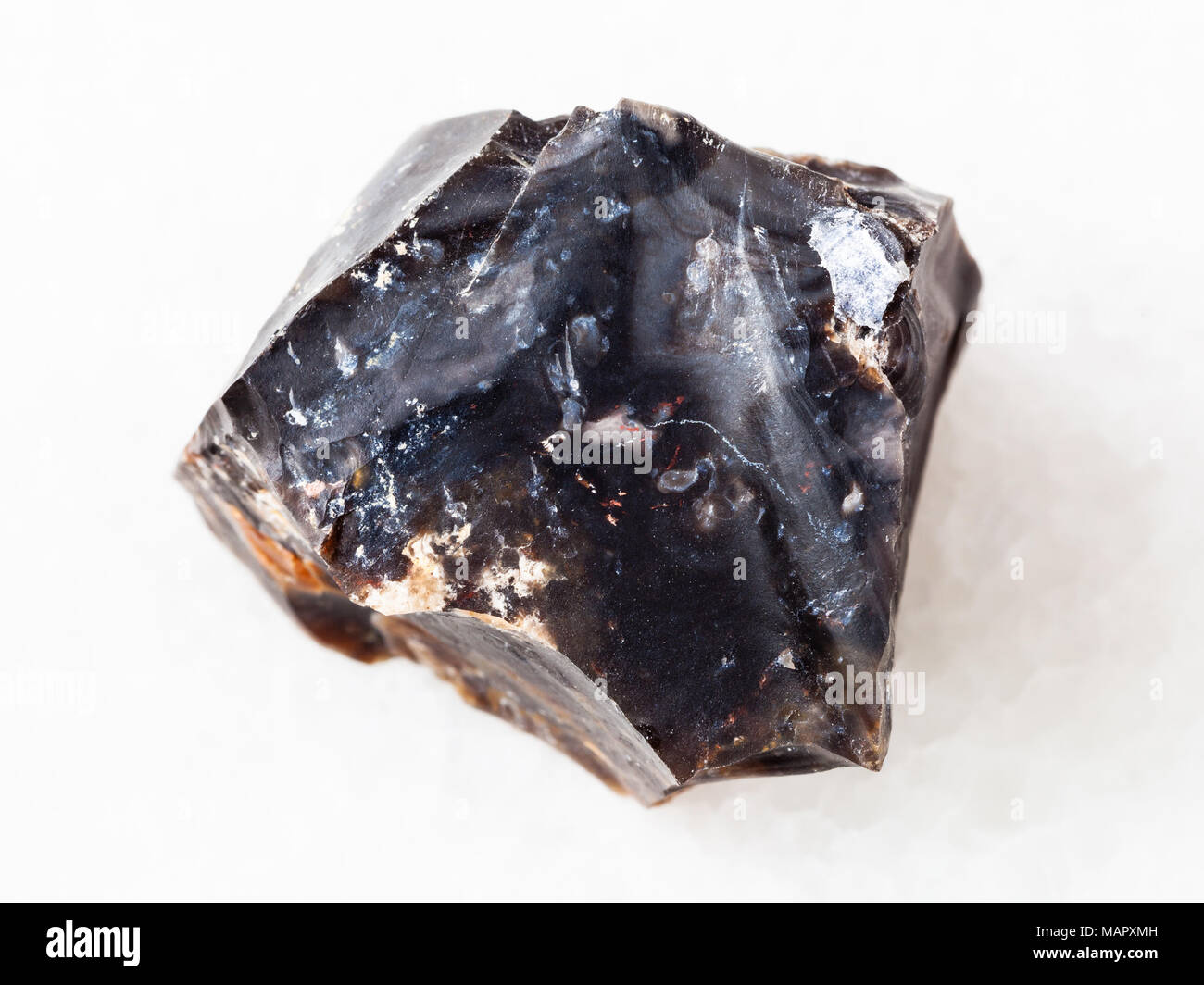 macro shooting of natural mineral rock specimen - rough black Flint ...