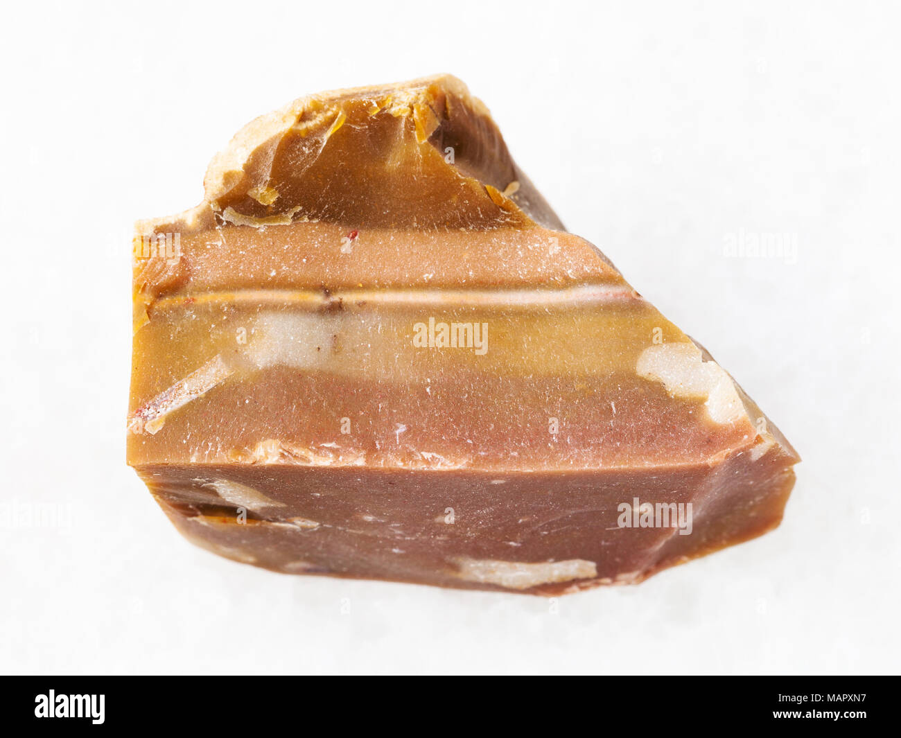 macro shooting of natural mineral rock specimen - Flint stone on white ...