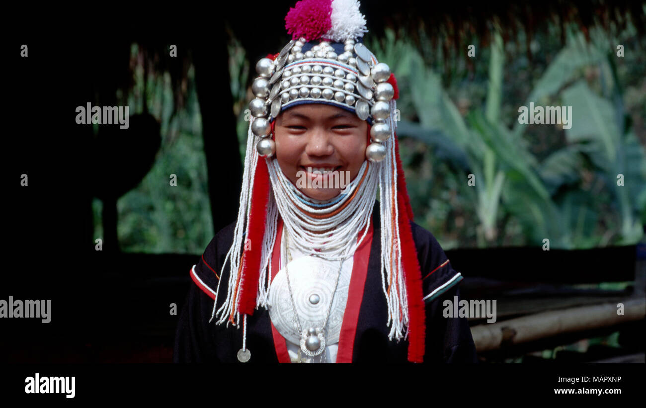 A young indigenous Akha hilltribe girl posing for a portrait in her ...