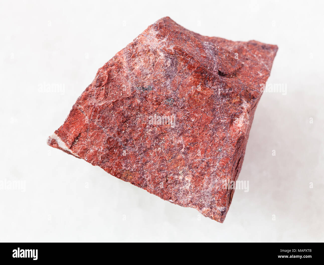 macro shooting of natural mineral rock specimen - rough red jasper ...