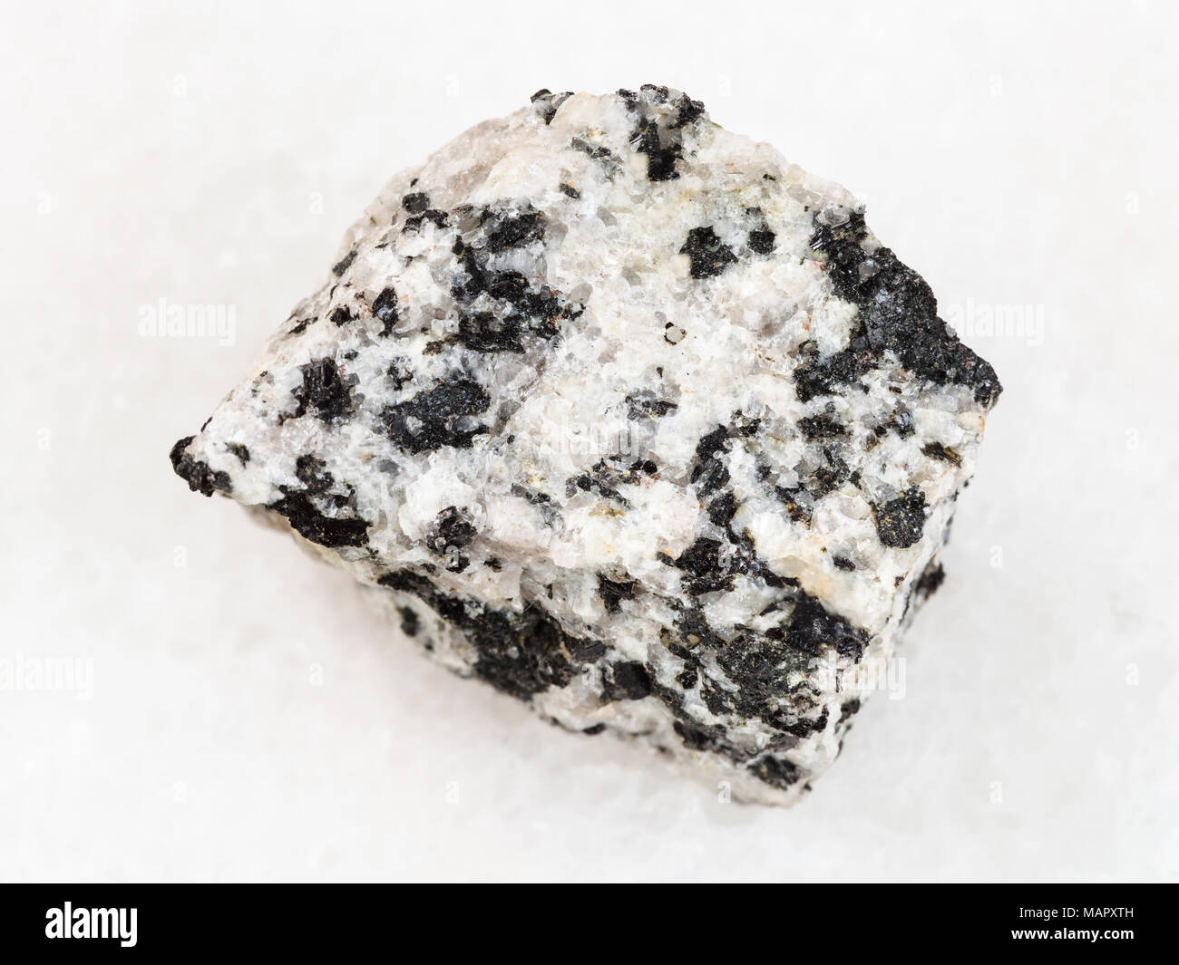 macro shooting of natural mineral rock specimen - raw white granite ...