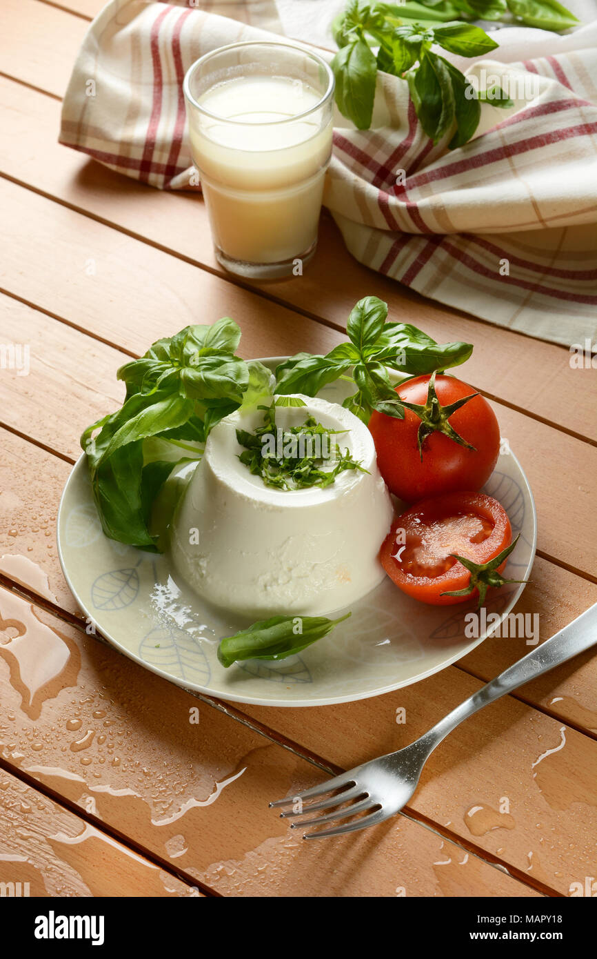ricotta cheese with basil and tomatoes - traditional Italian dairy ...