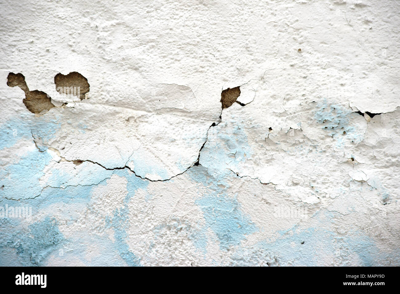 The close-up of a wall with a chipped plaster and paint layer Stock ...