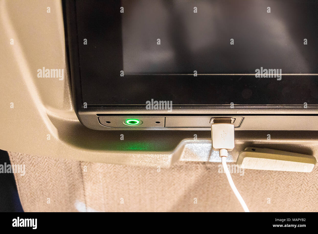 USB cable connected on the entertainment screen usb socket on an ...