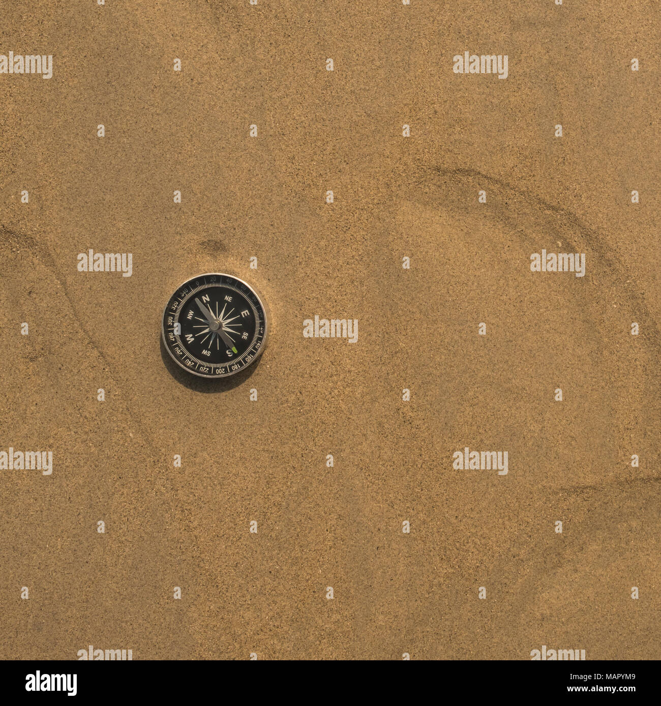 compass at beach sunny day, summer time Stock Photo - Alamy
