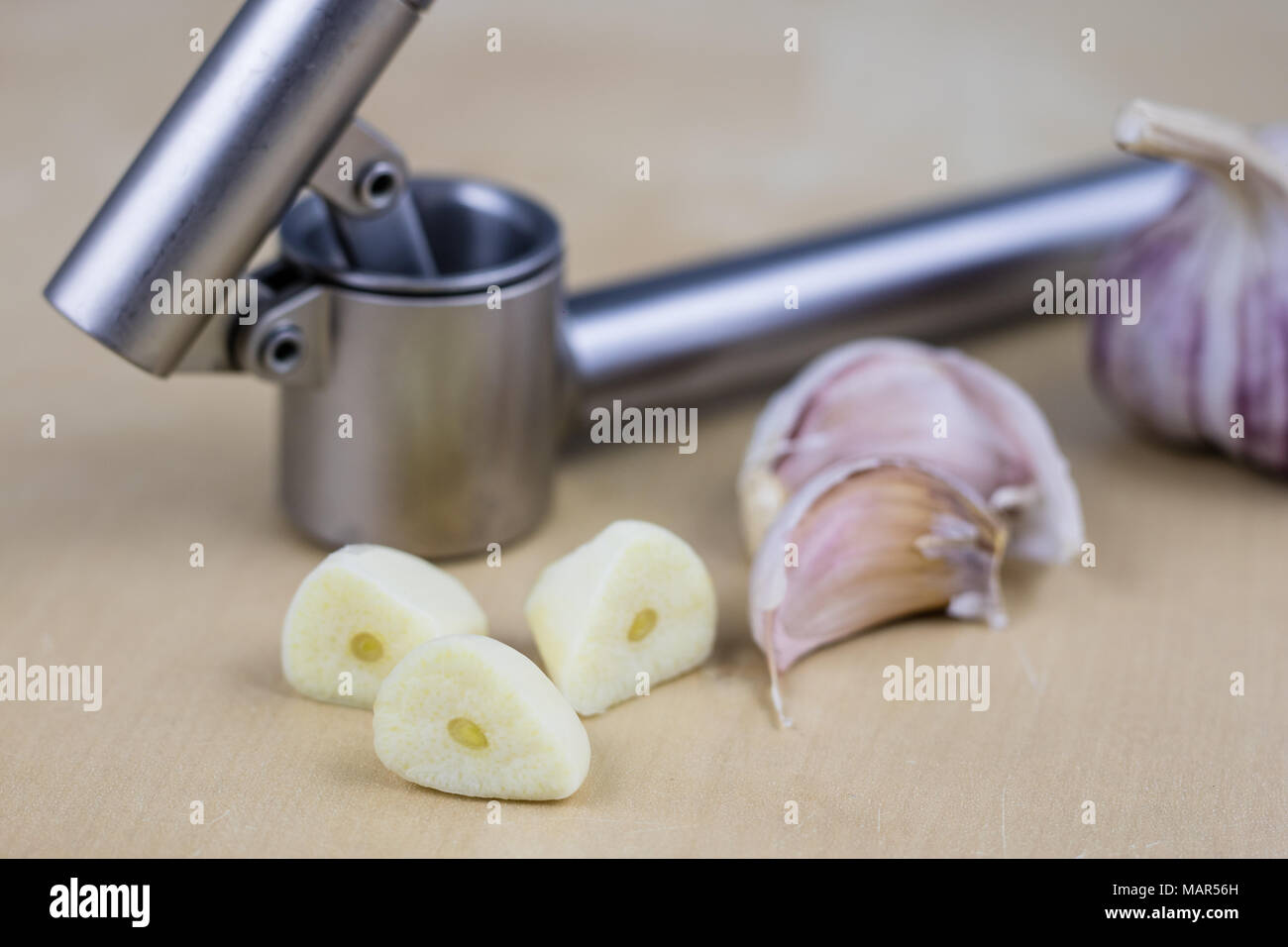 A healthy and medicinal garlic syrup squeezed with a kitchen squeezer ...