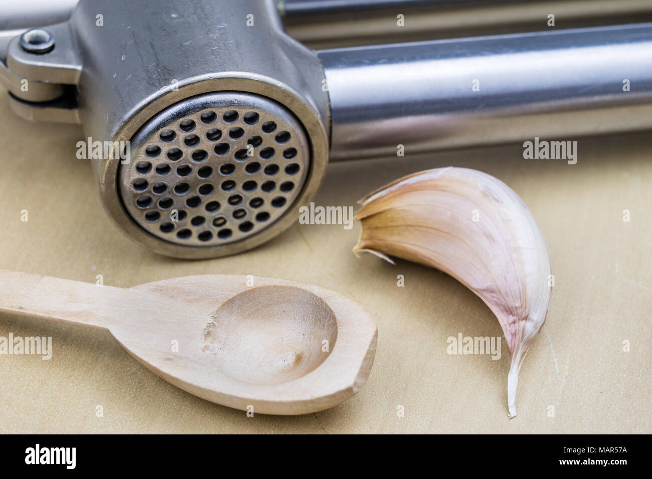 A healthy and medicinal garlic syrup squeezed with a kitchen squeezer ...