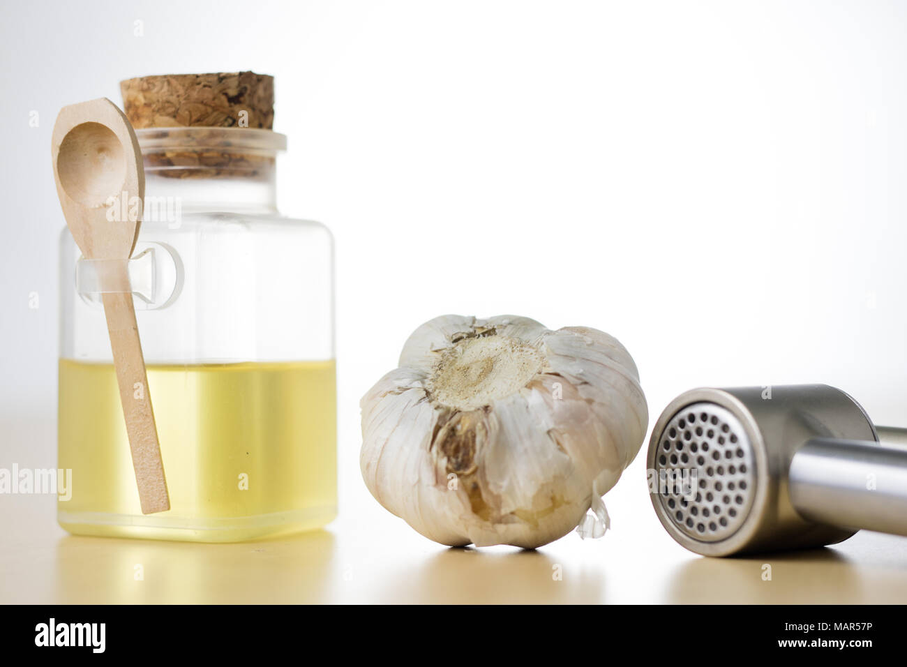 A healthy and medicinal garlic syrup squeezed with a kitchen squeezer ...