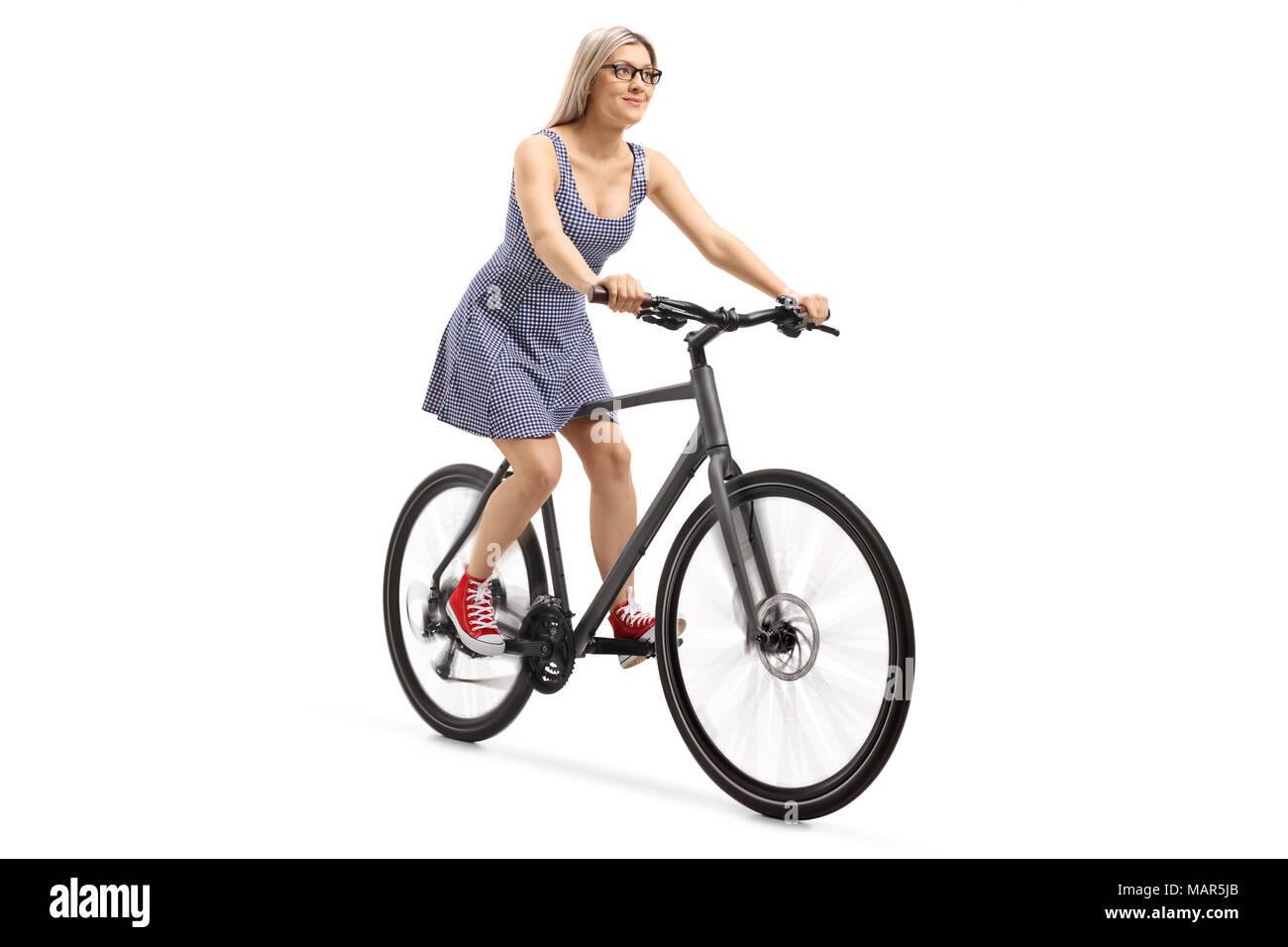 Young woman riding a bicycle isolated on white background Stock Photo ...