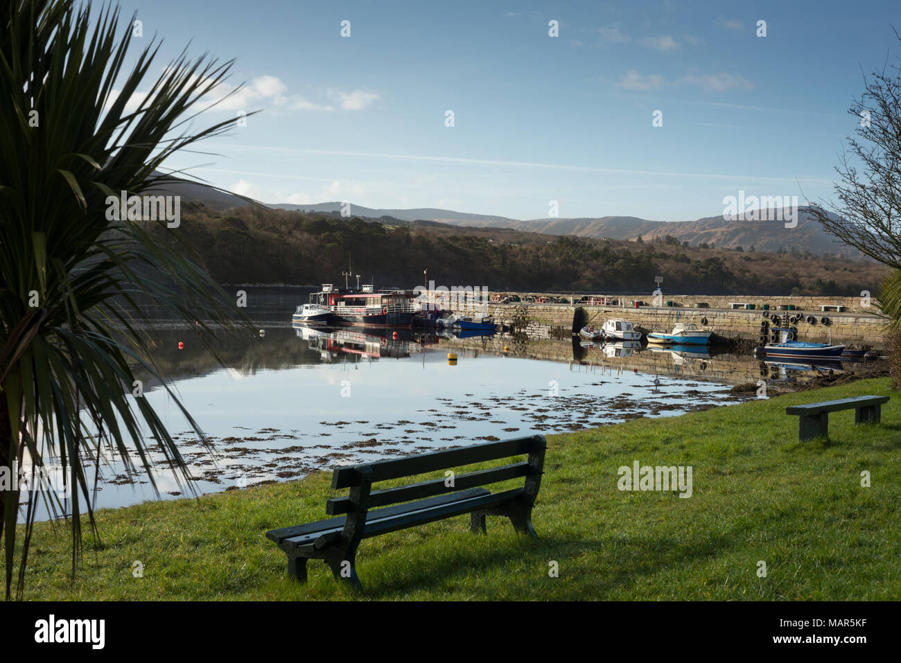 View of Kenmare Harbour with moored boats and yachts at Kenmare Bay ...