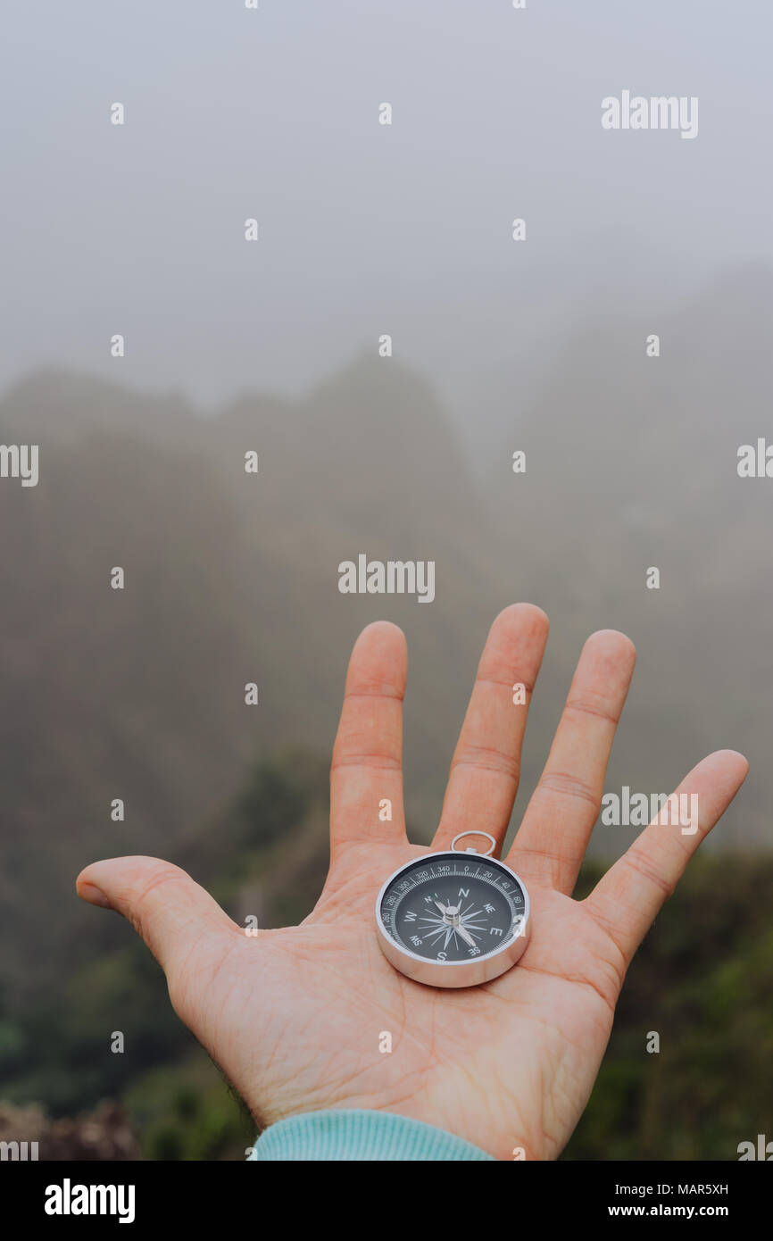 Close up hand holding compass the coast hi-res stock photography and ...