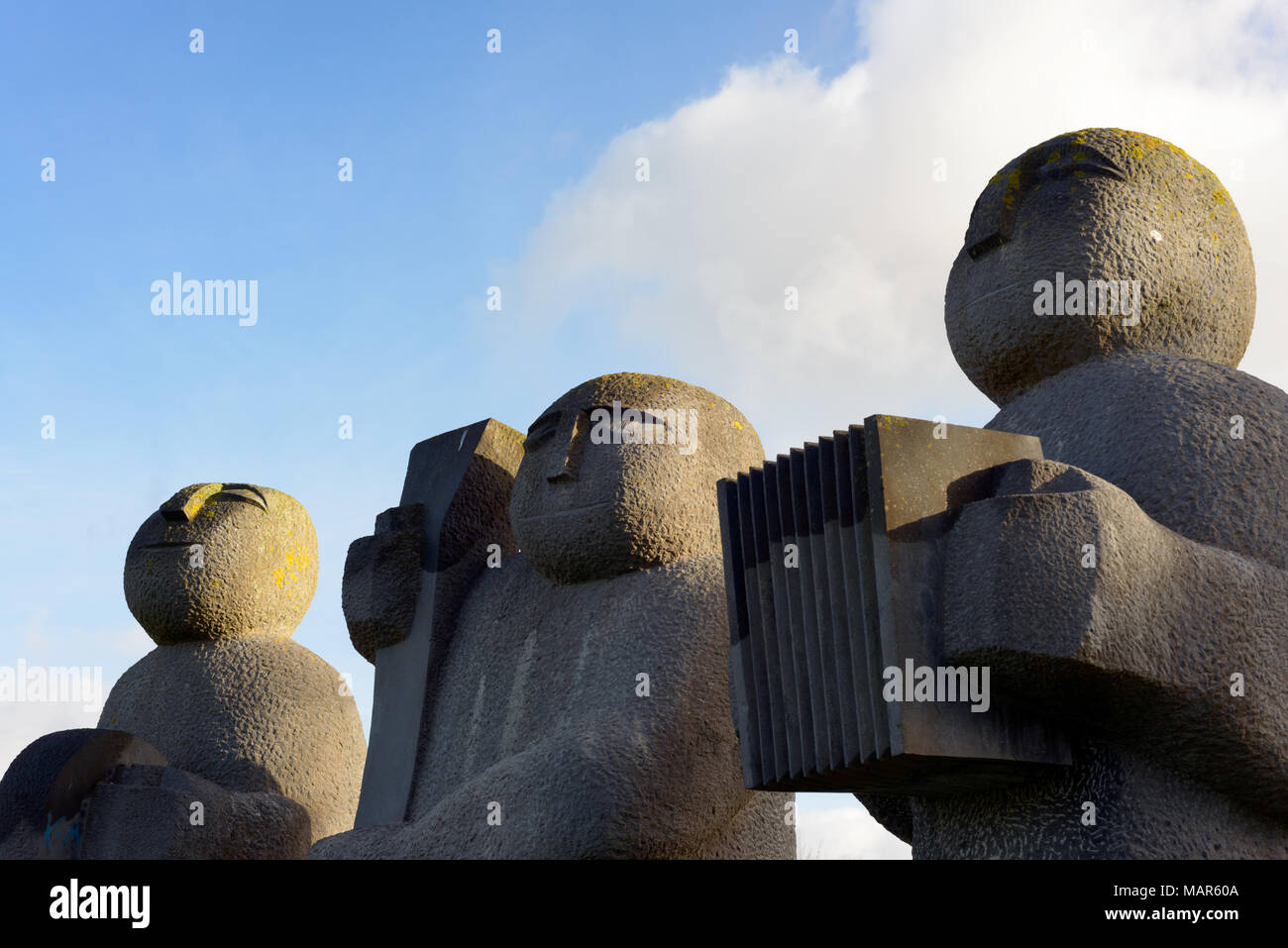 Three musicians limestone sculpture at Kenmare Bay, County Kerry ...