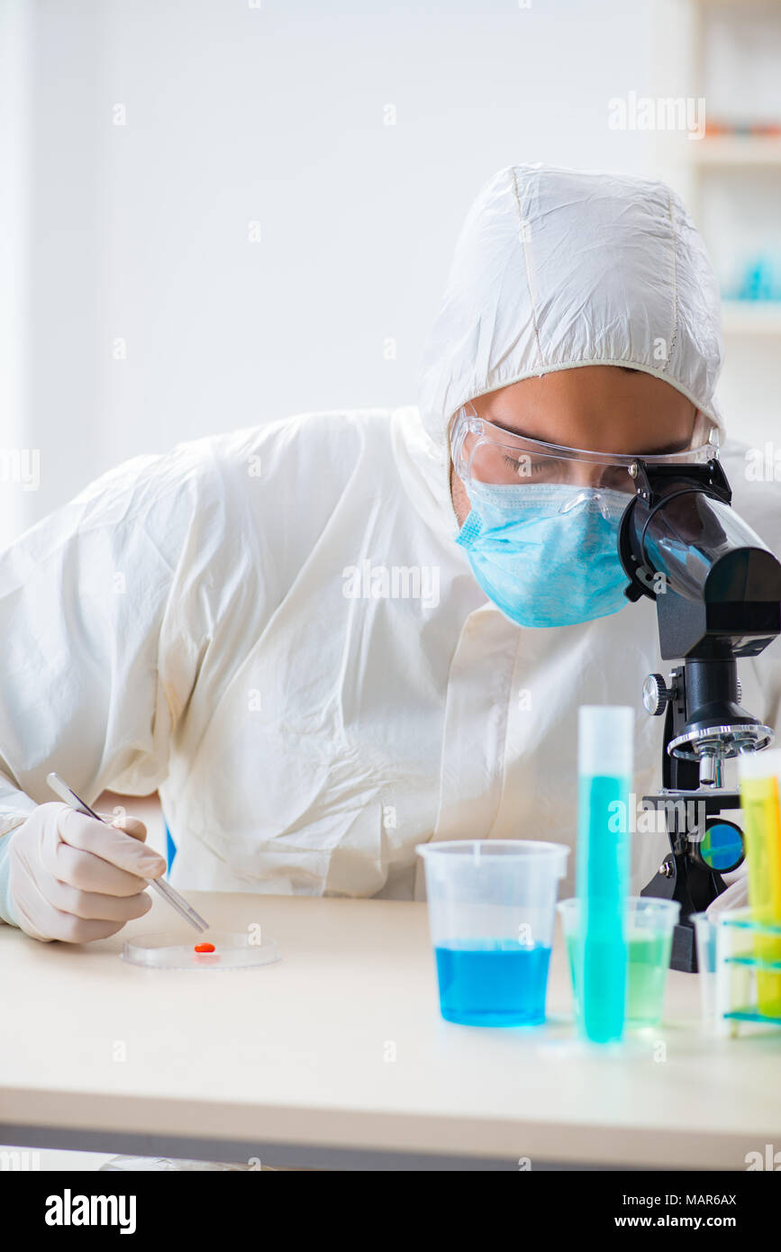 Lab assistant in drug synthesis concept Stock Photo - Alamy