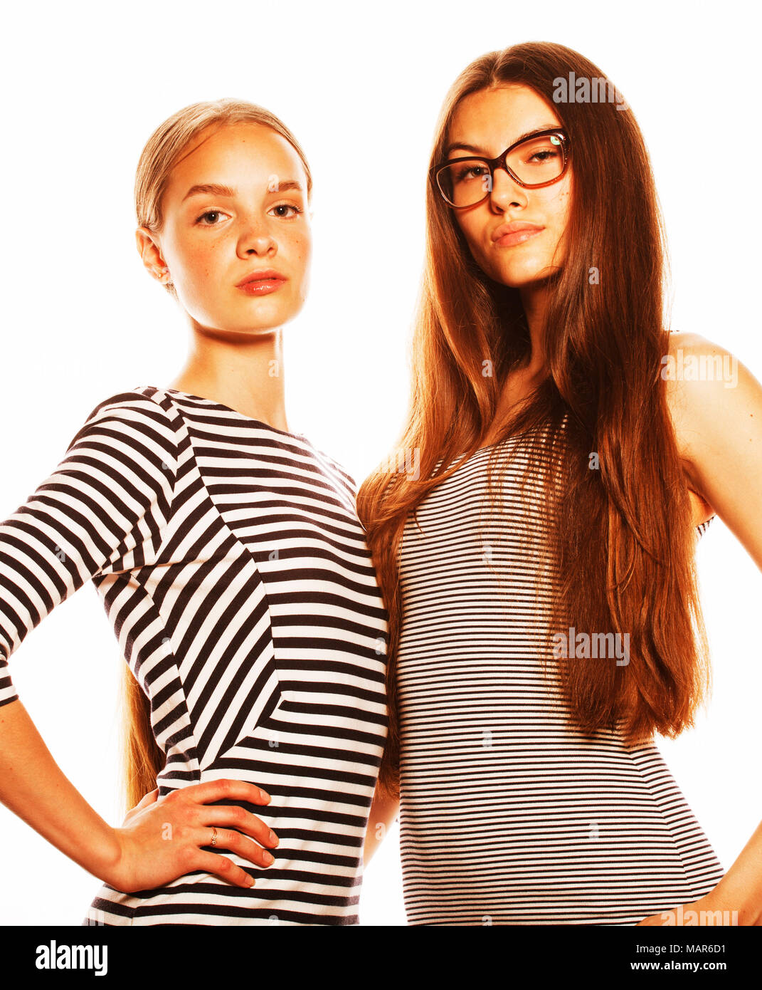 two young workers isolated on white, same dresses in strip Stock Photo ...