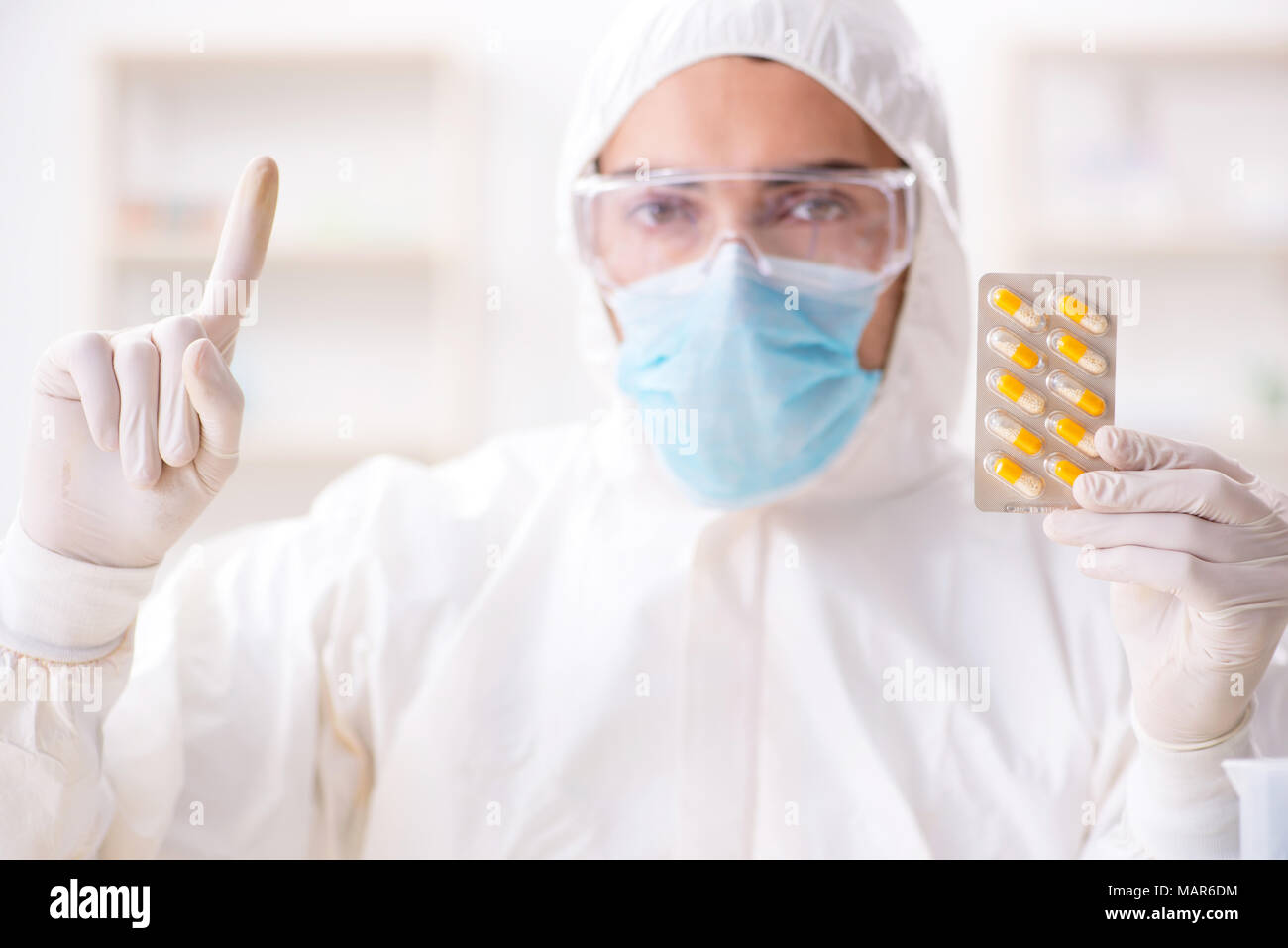 Lab assistant in drug synthesis concept Stock Photo - Alamy