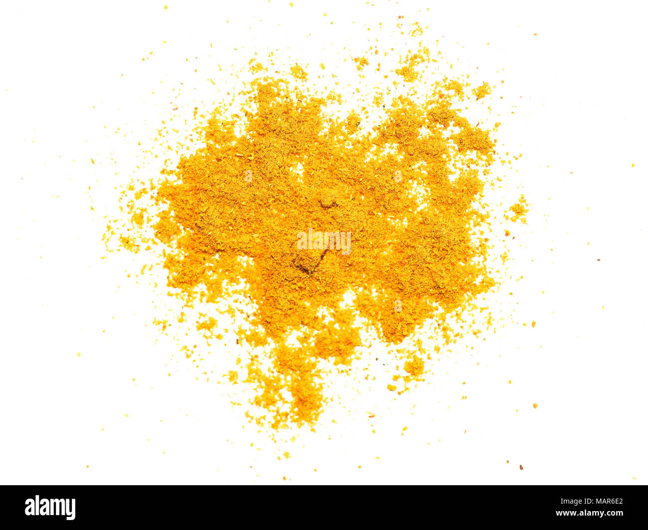 Curry powder is a blend of hot Indian spices over white background ...