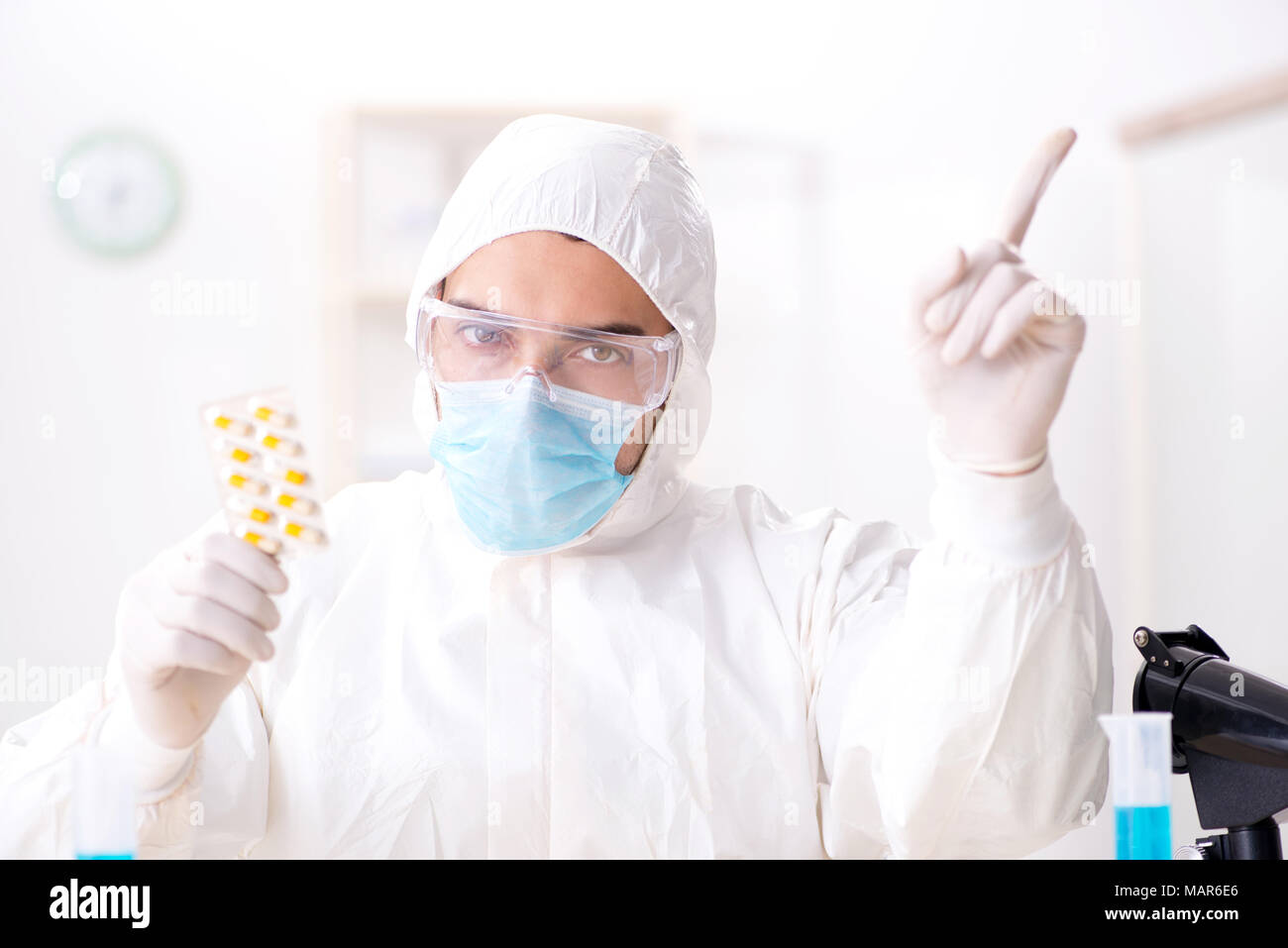 Lab assistant in drug synthesis concept Stock Photo - Alamy