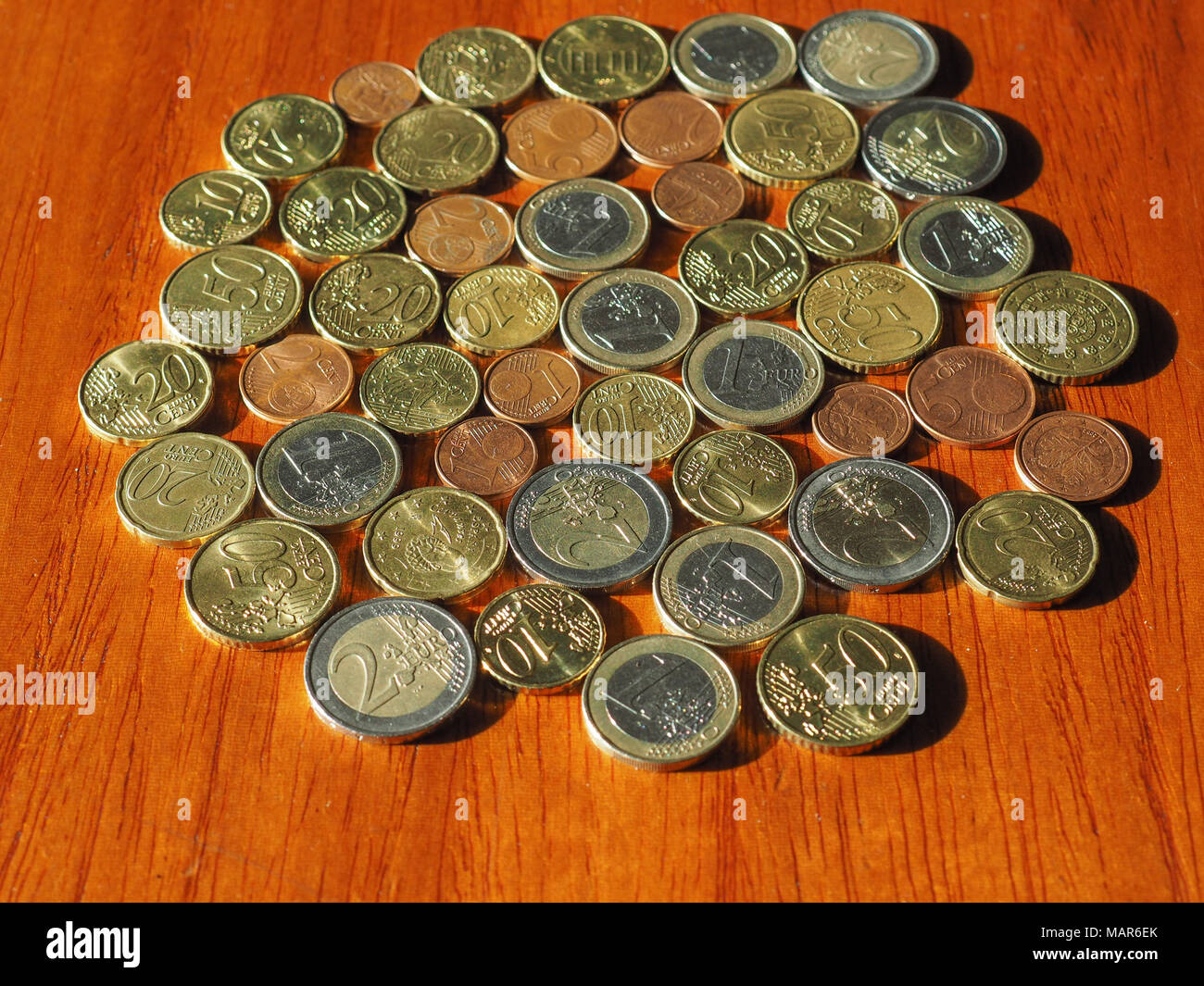 Euro coins money (EUR), currency of European Union on wooden desk Stock ...