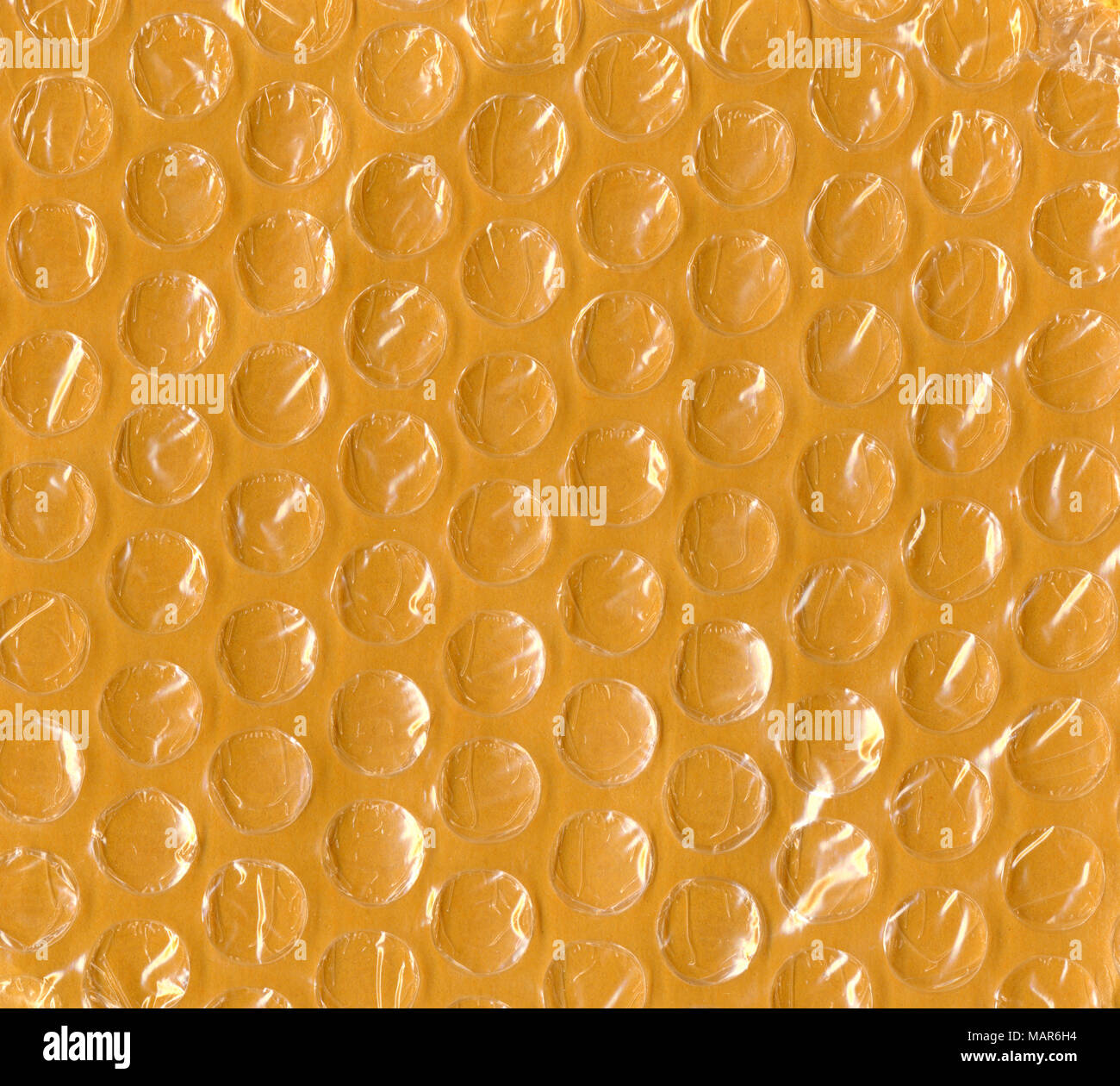 yellow bubble wrap texture useful as a background Stock Photo - Alamy