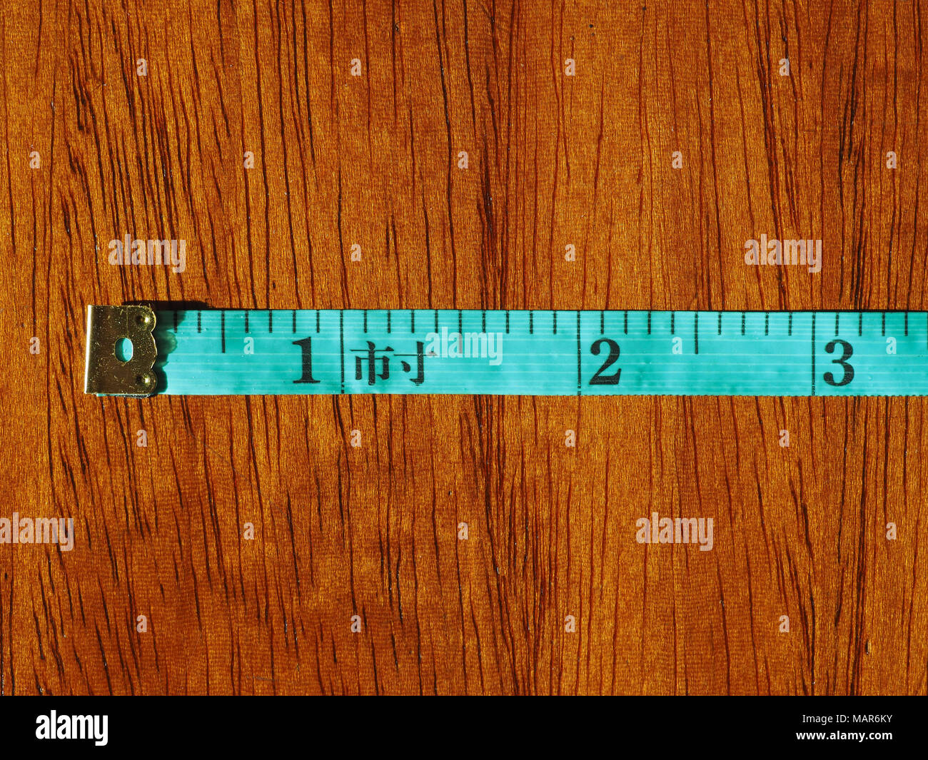 soft tailor meter ruler in metric units on a wooden desk Stock Photo ...