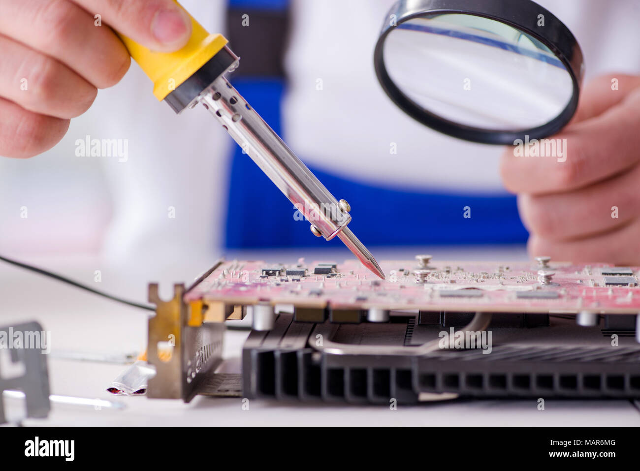 Computer hardware repair and fixing concept by experienced technician ...