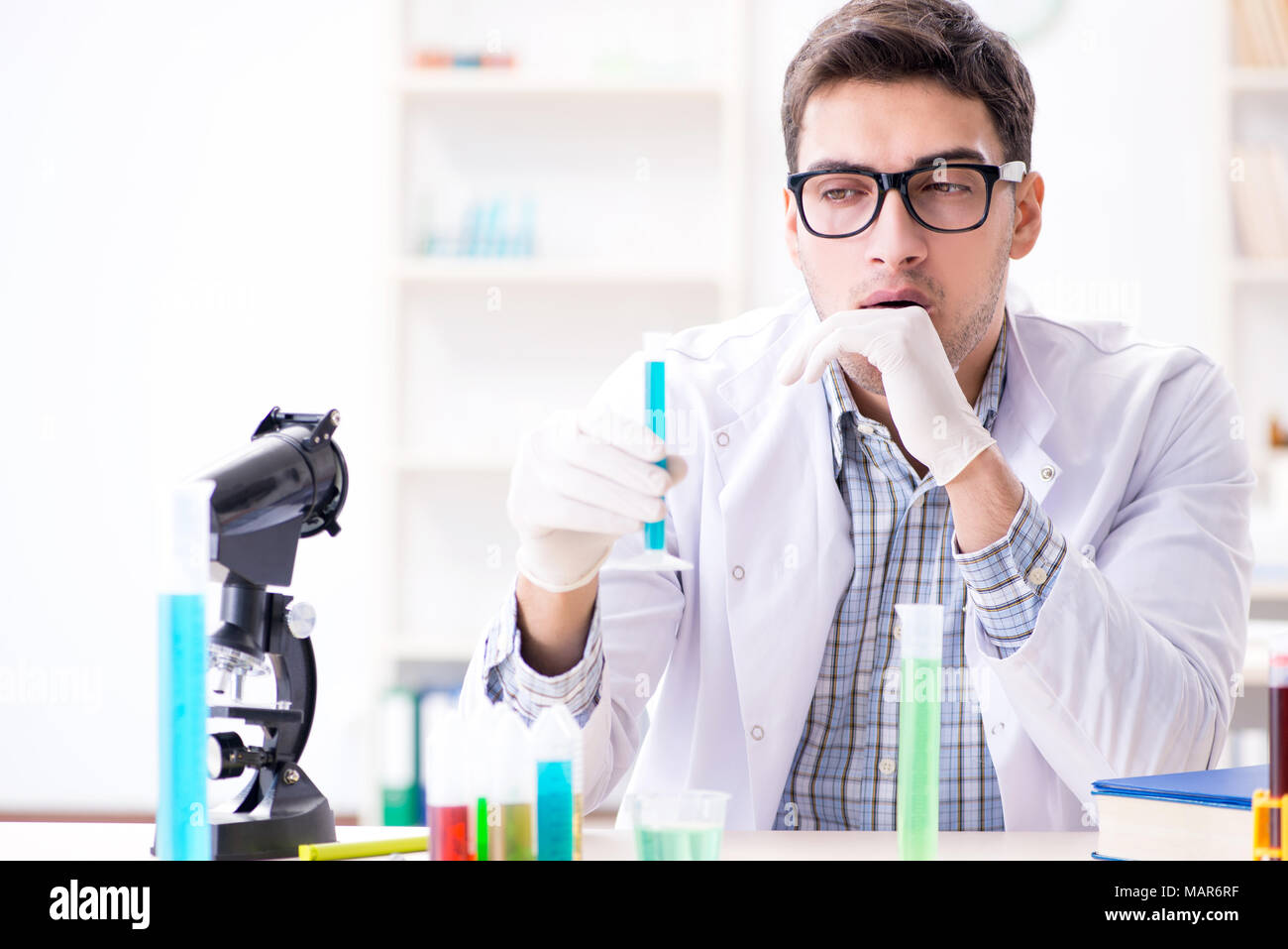 Chemistry student doing chemical experiments at classroom activity ...