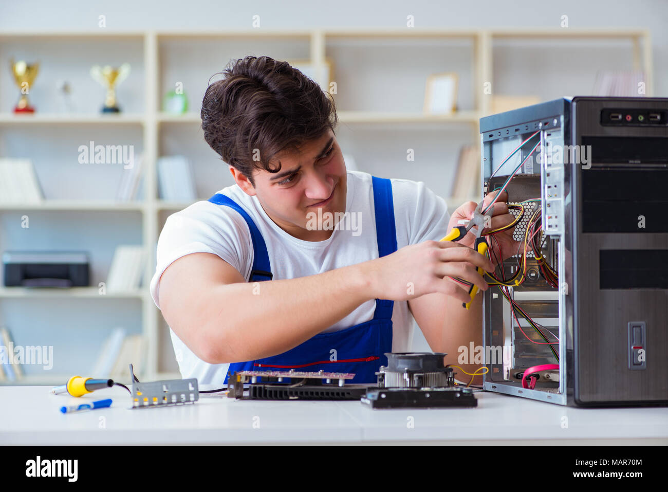 Computer hardware repair and fixing concept by experienced technician ...