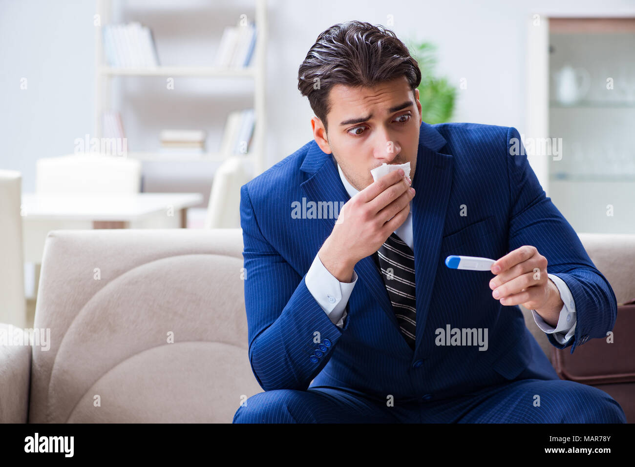 Sick employee staying at home suffering from flue Stock Photo - Alamy