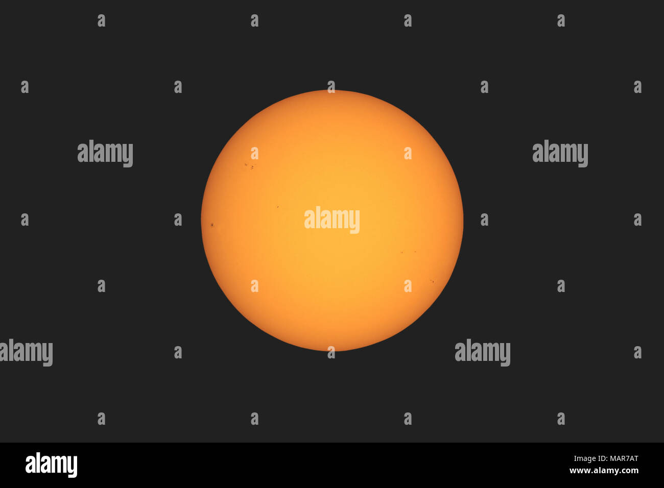 the Sun seen with telescope from planet Earth, with sunspots visible as ...