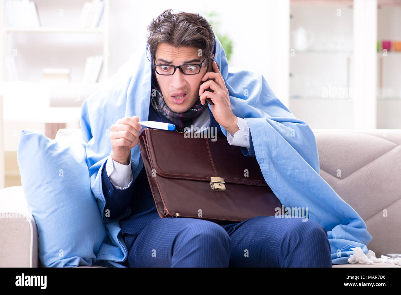 Sick employee staying at home suffering from flue Stock Photo - Alamy