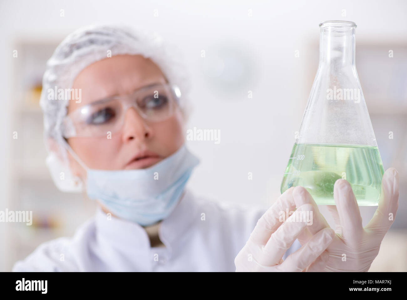 Woman chemist working in hospital clinic lab Stock Photo - Alamy