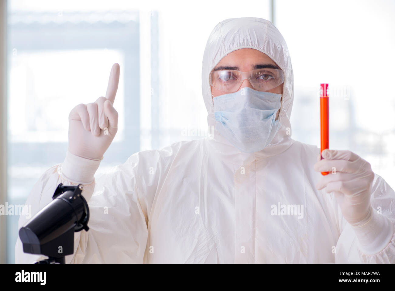 Young chemist student working in lab on chemicals Stock Photo - Alamy