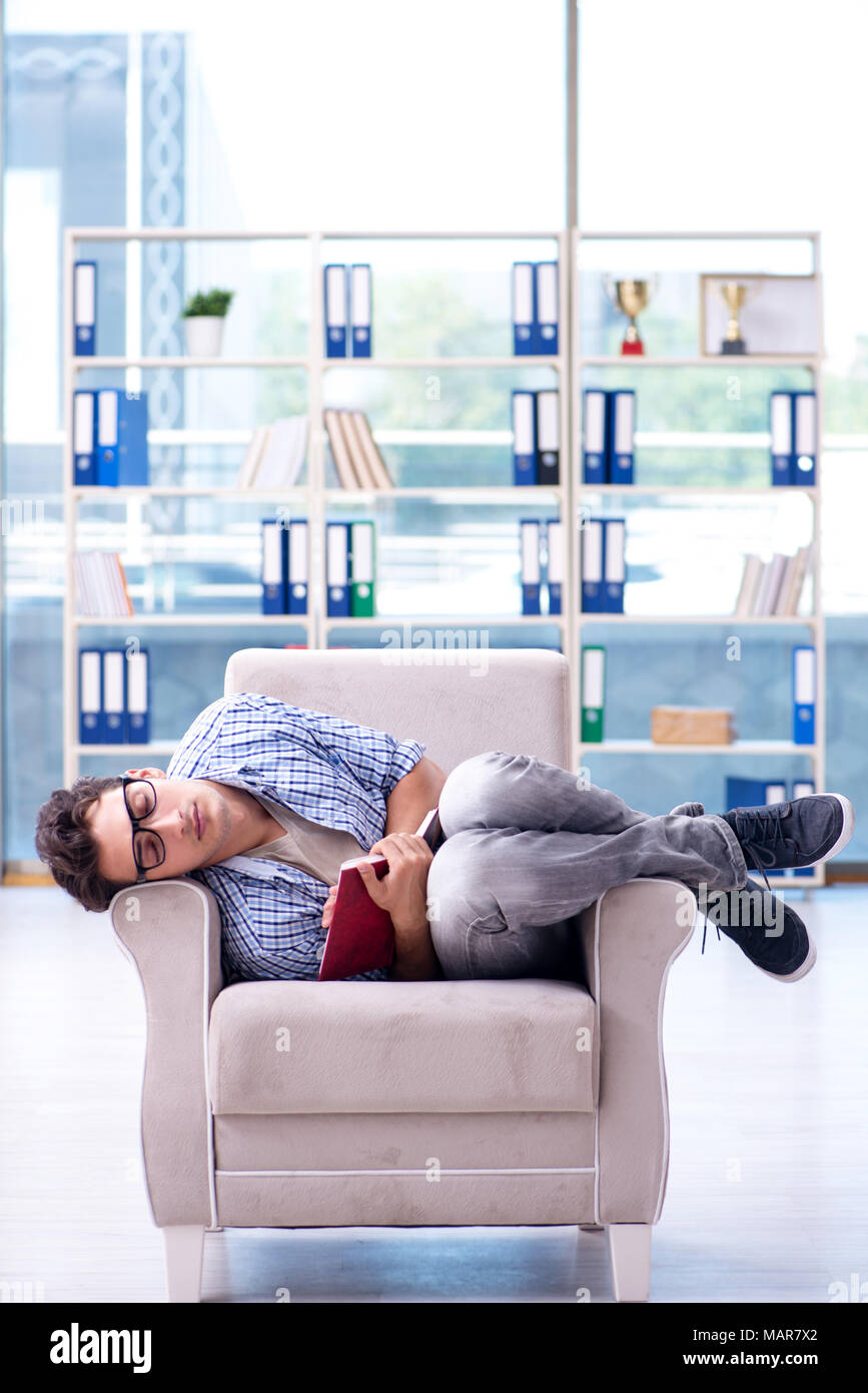 Student reading books and preparing for exams in library Stock Photo ...