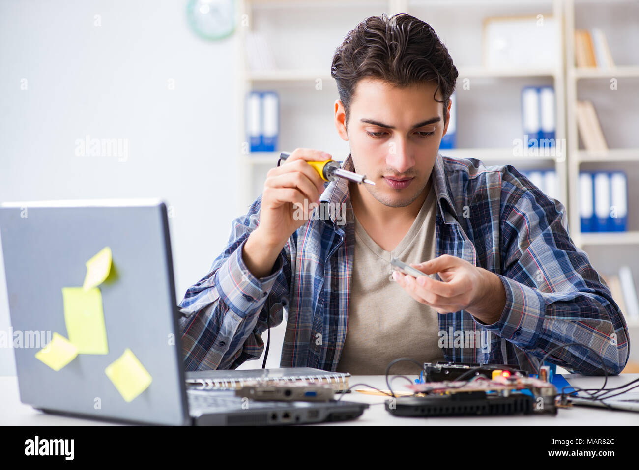 Computer hardware repair and fixing concept by experienced technician ...