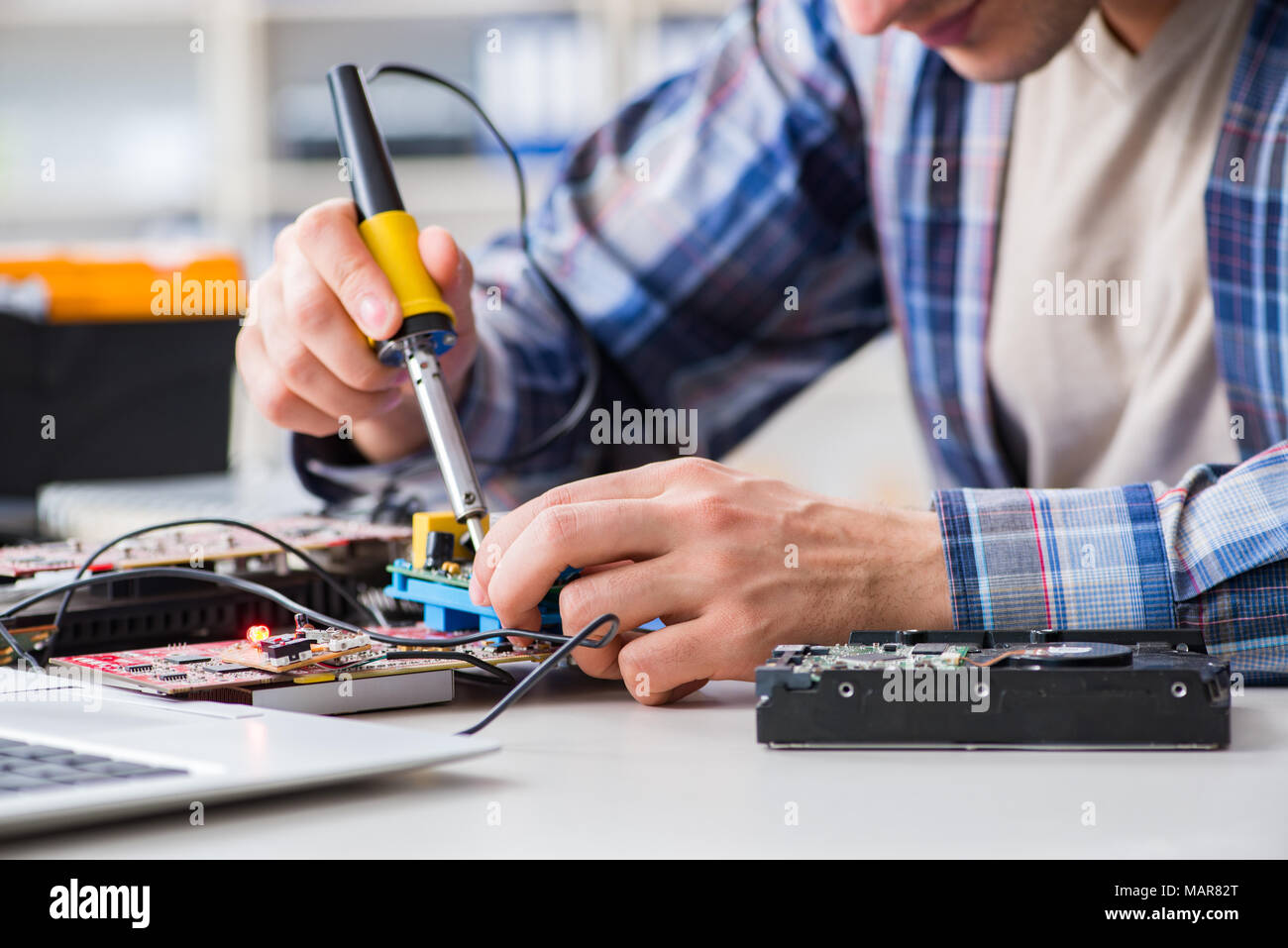 Computer hardware repair and fixing concept by experienced technician ...