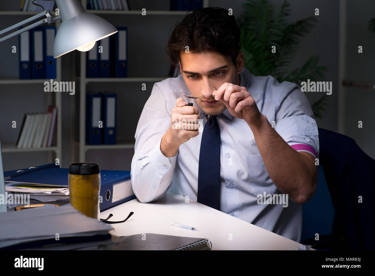 Employee relieving stress from overtime with drugs narcotics Stock ...