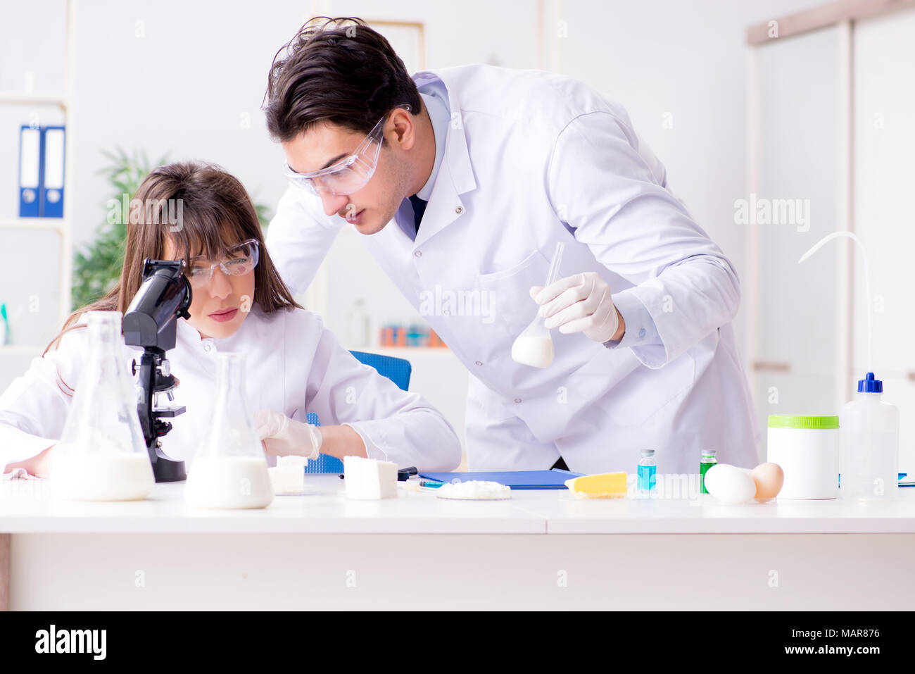 Two lab doctor testing food products Stock Photo - Alamy