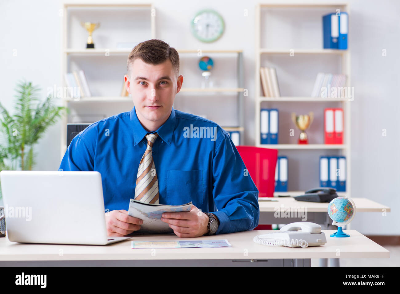 Young handsome businessman employee working in office at desk Stock ...