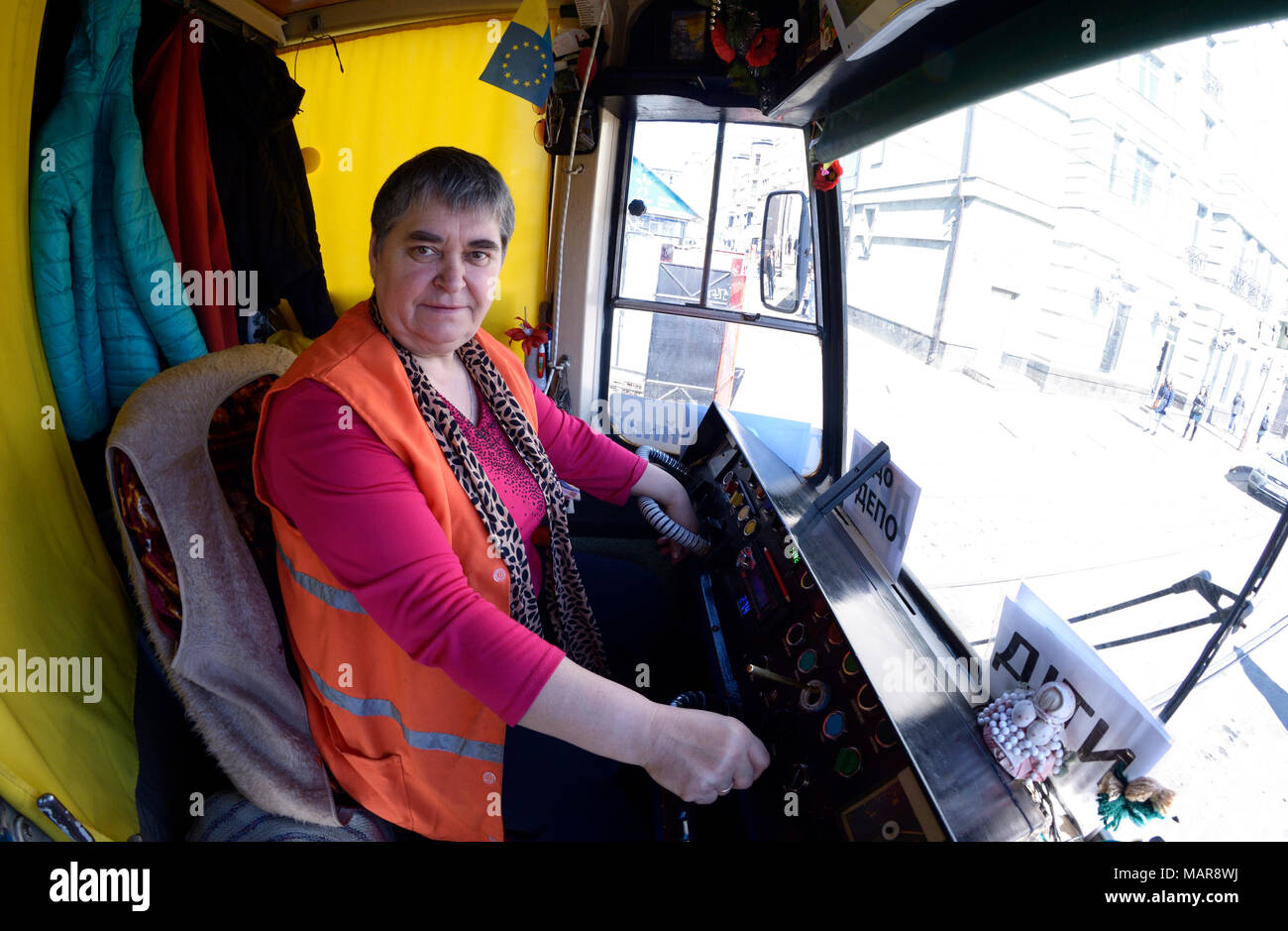 Female streetcar driver sitі at her workplace in the driver’s cabin ...
