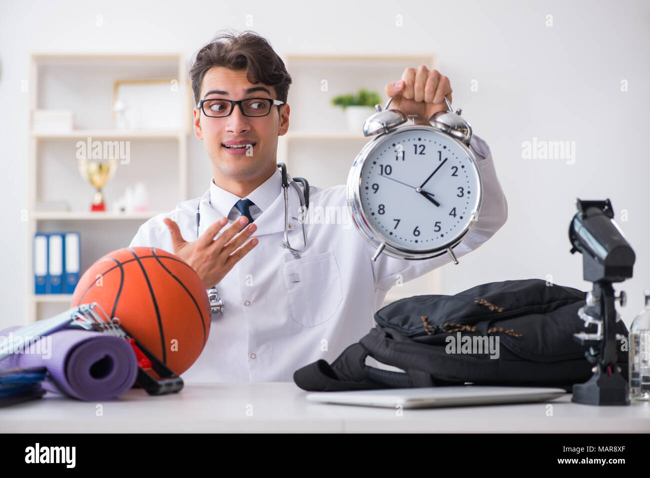 Doctor going to sports during lunch break Stock Photo - Alamy
