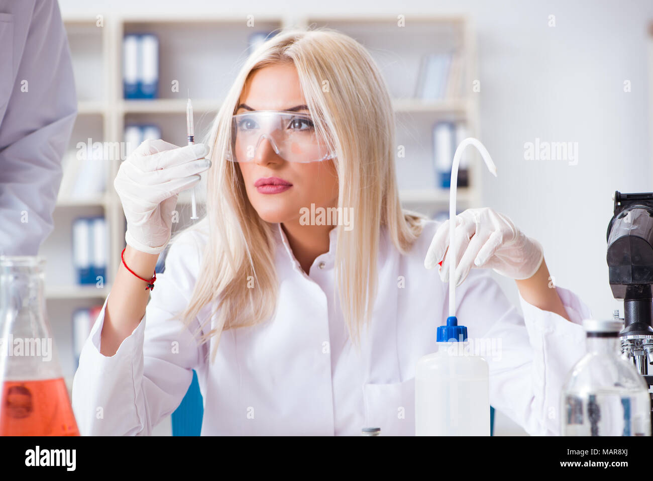 Young female woman doctor in hospital clinic lab Stock Photo - Alamy