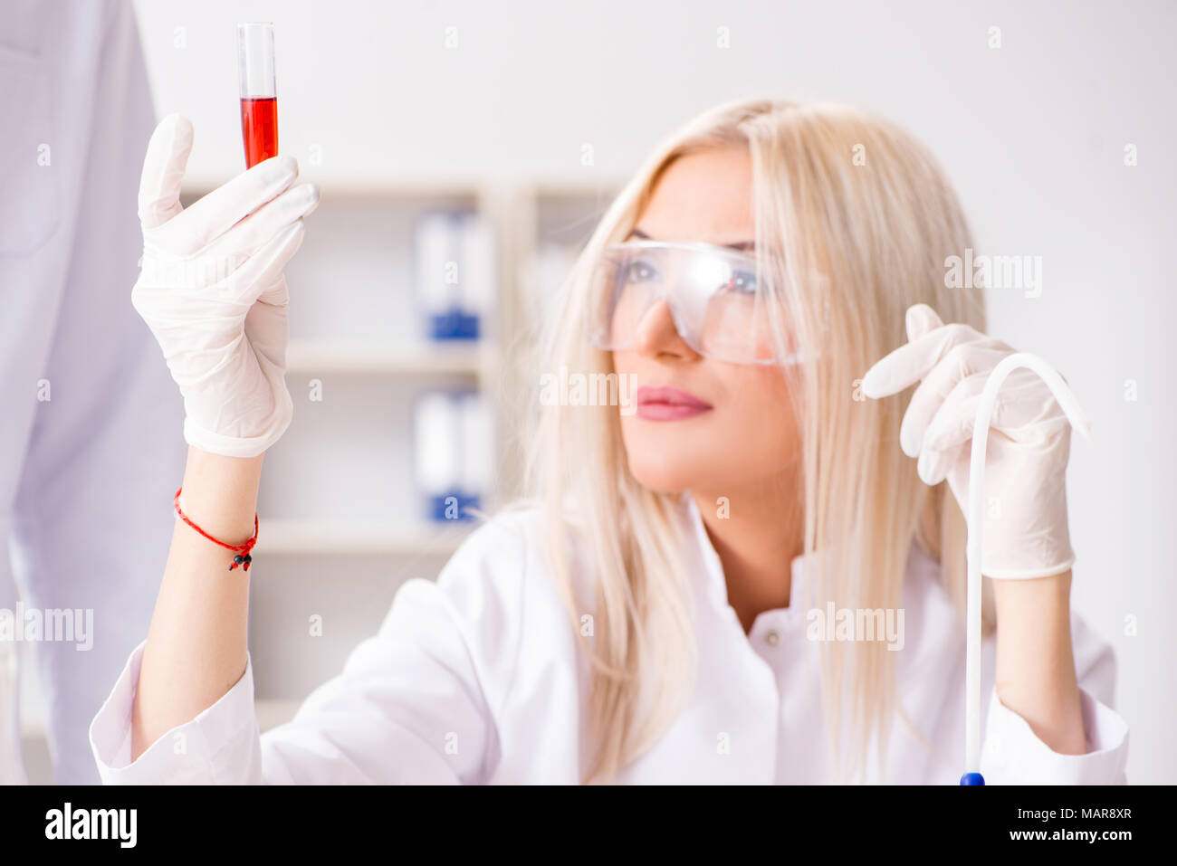 Young female woman doctor in hospital clinic lab Stock Photo - Alamy