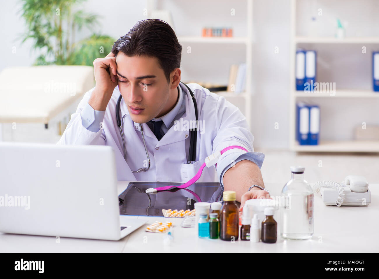 Doctor drug addict in the hospital Stock Photo - Alamy