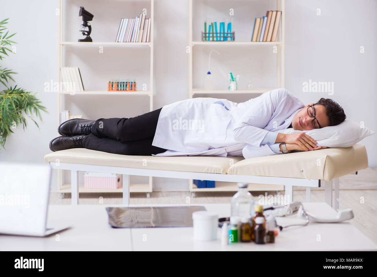 Doctor relaxing after complex surgery in hospital Stock Photo - Alamy