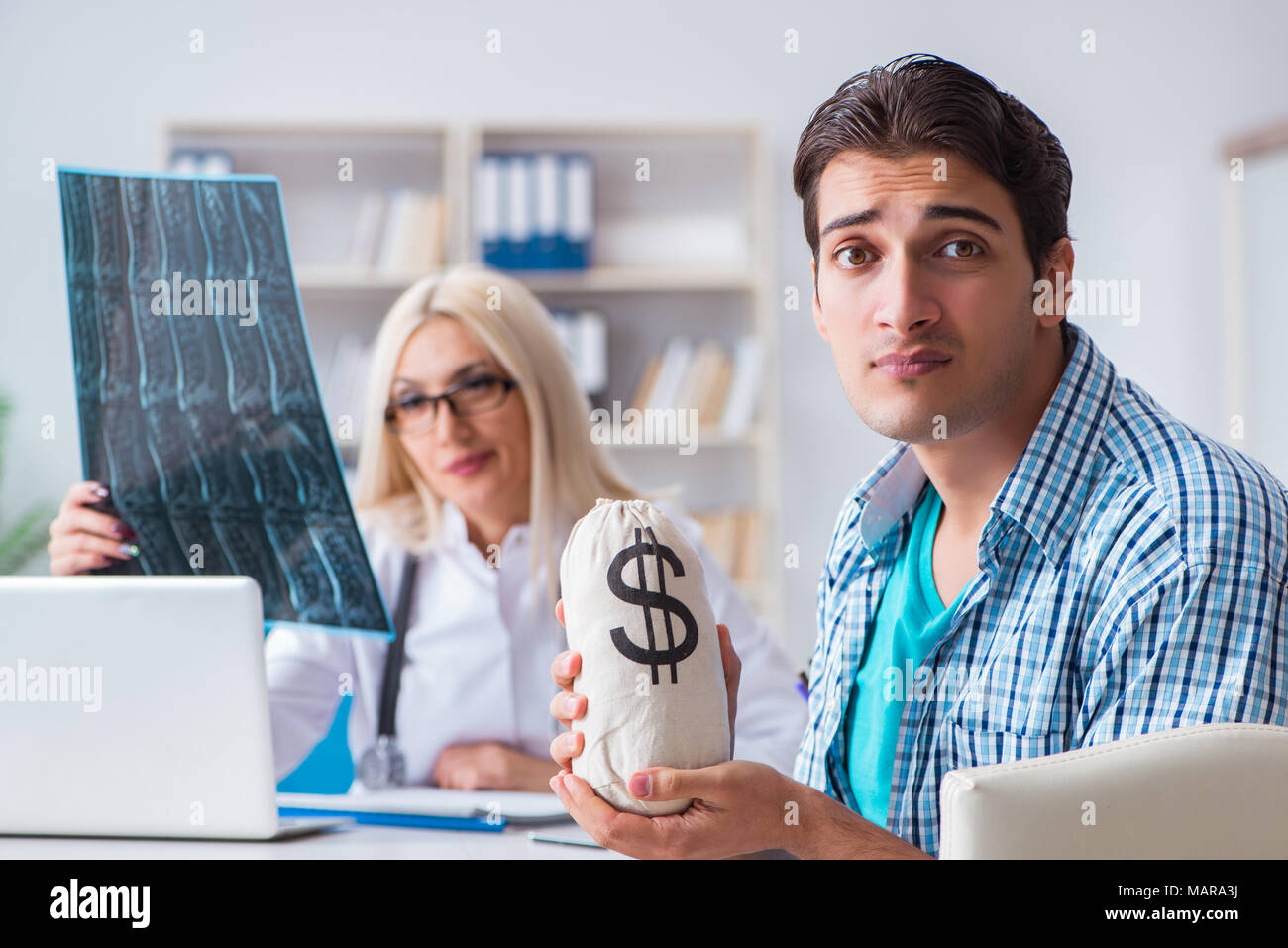 Male patient angry at expensive healthcare bill Stock Photo - Alamy