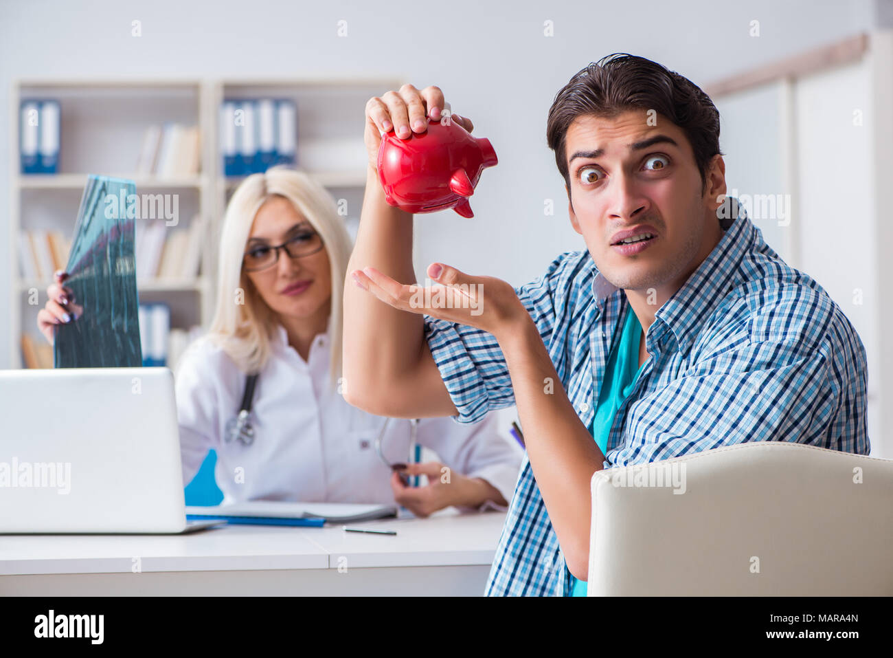 Male patient angry at expensive healthcare bill Stock Photo - Alamy