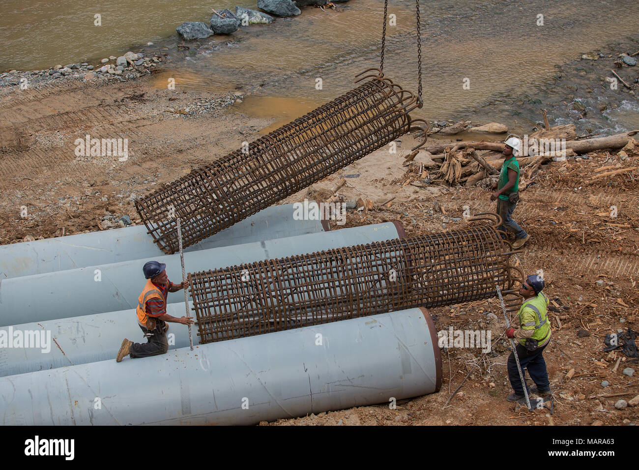 UTUADO, Puerto Rico, Jan. 31, 2018--A crane lifts a rebar case that ...